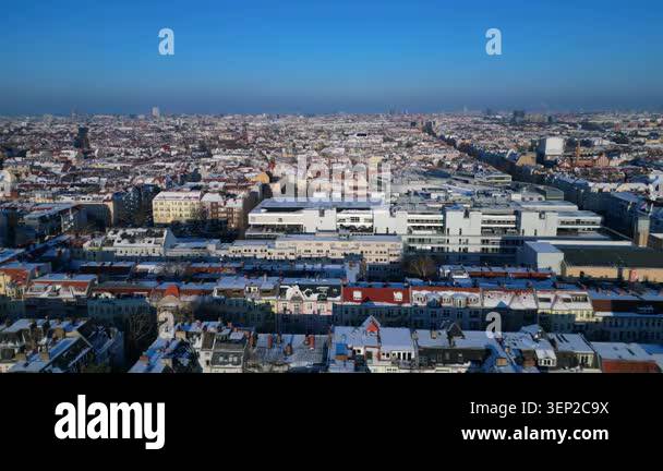 Berlin cityscape with buildings and streets covered in fresh snow on a ...