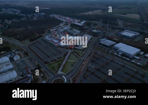 Aerial view of an outlet shopping center with empty parking lots ...