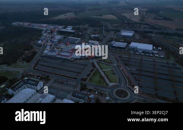 Aerial view of an outlet shopping center with empty parking lots ...