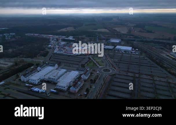 Aerial view of an outlet shopping center with empty parking lots ...