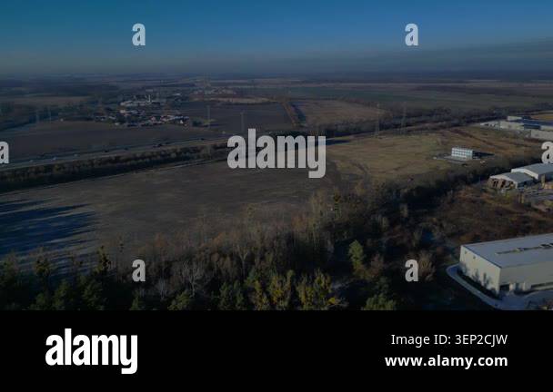 Large industrial complex featuring multiple factory buildings, material ...