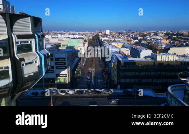 Berlin cityscape with snow covered buildings and a busy street, showing ...