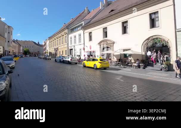 Budapest, Hungary May 2, 2026: Street scene in the historic Buda Castle ...