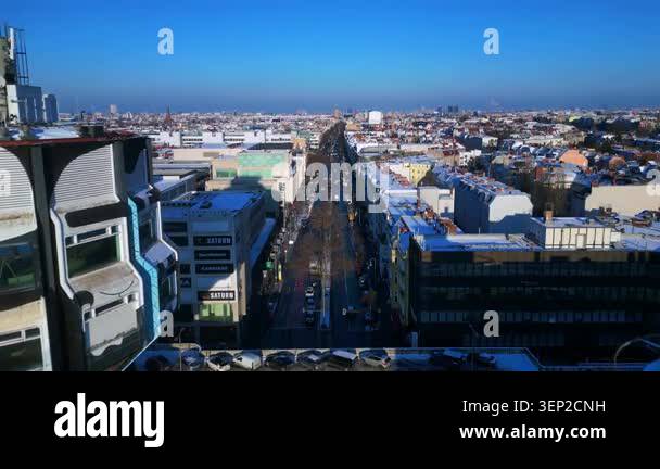 Berlin cityscape with snow covered buildings and a busy street, showing ...