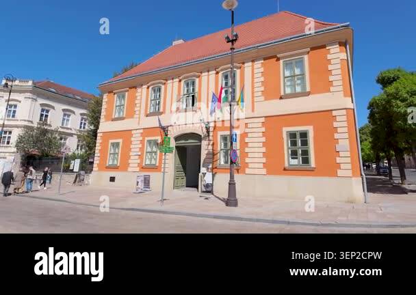 Pcs, Hungary May 3, 2026: Historic municipal building with national ...
