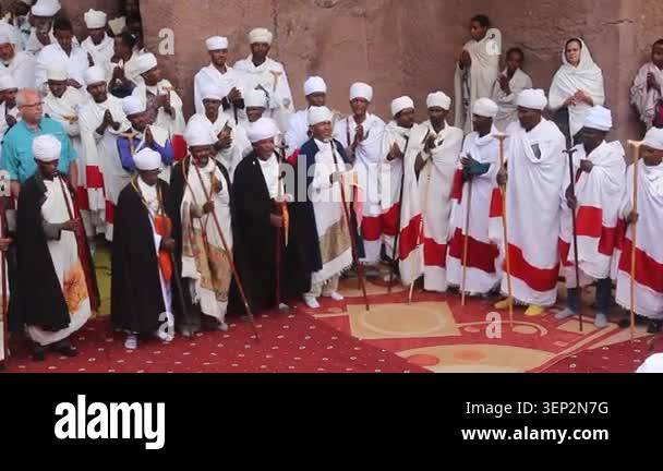 LALIBELA, ETHIOPIA - MARCH 29, 2019: Christian priests in front of Bet ...
