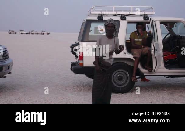 DANAKIL, ETHIOPIA - MARCH 24, 2019: Dancing armed Afar guard at a salt ...