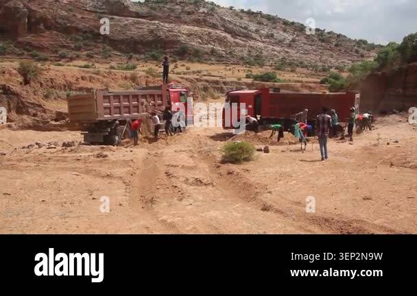 WUKRO, ETHIOPIA - MARCH 22, 2019: Local people loading sand into a ...