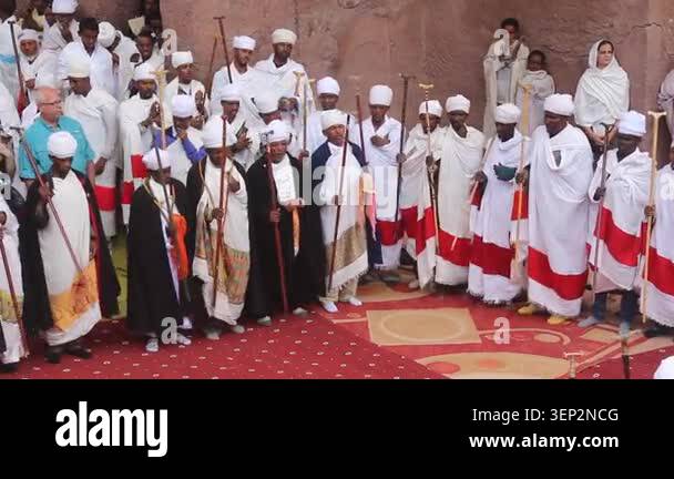 LALIBELA, ETHIOPIA - MARCH 29, 2019: Christian priests in front of Bet ...