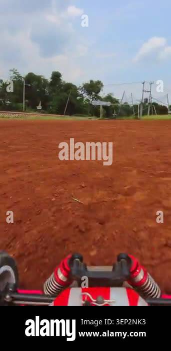 4K Video of Red buggy races across dusty dirt track. First-person view ...