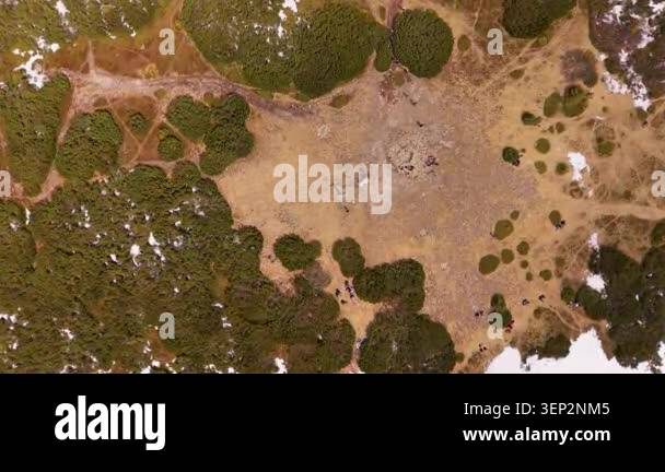 Aerial drone view of Pilsko mountain summit with hikers and snow ...