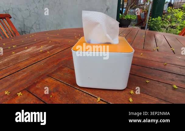 Vertical Footage of a hand picking up a tissue in a box. Tissue box ...