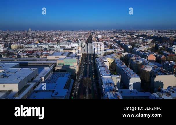 Berlin cityscape with snow covered buildings and a busy street, showing ...