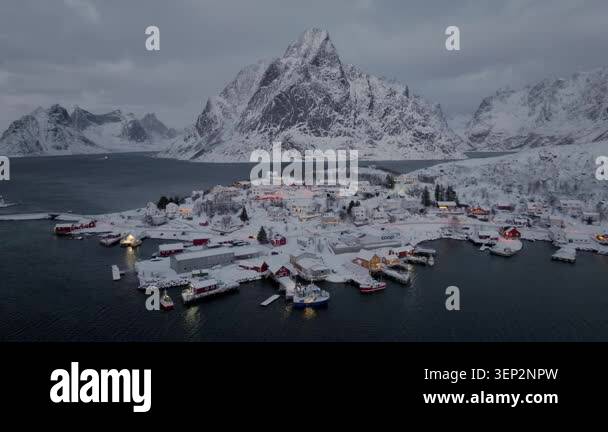 High aerial view showing a small fishing village clustered on a rocky ...