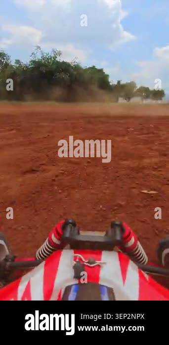 4K Vertical Video of Buggy RC Car racing on dirt ground. Dust swirls ...