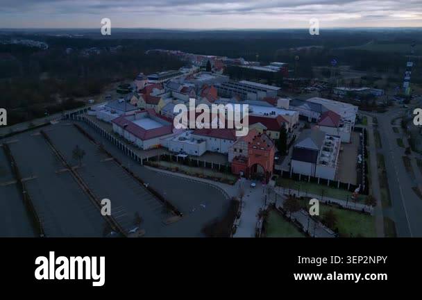 Drone view showing a large shopping retail park with various commercial ...