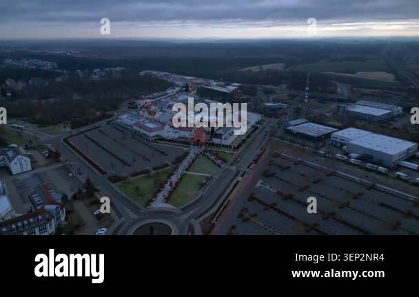 Drone view showing a large shopping retail park with various commercial ...