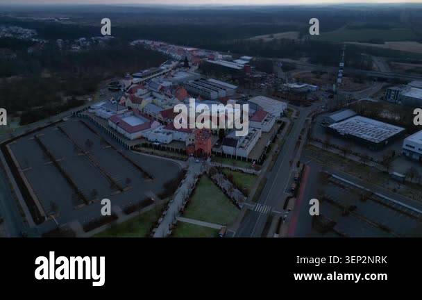 Drone view showing a large shopping retail park with various commercial ...