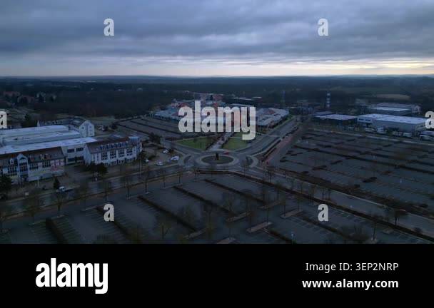 Drone view showing a large shopping retail park with various commercial ...