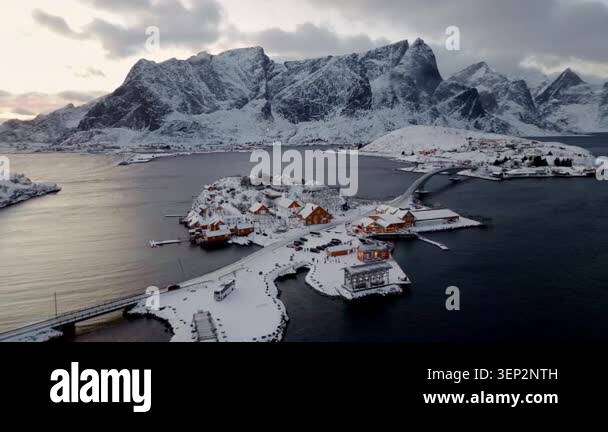 Birds-eye view of a small wooden fishing village on a narrow snow ...