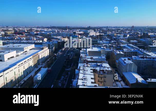 Berlin cityscape with snow covered buildings and a busy street, showing ...