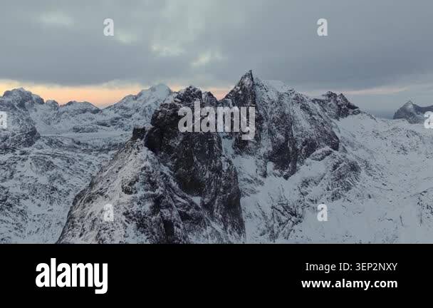 Aerial perspective of a jagged mountain ridge and central steep summit ...