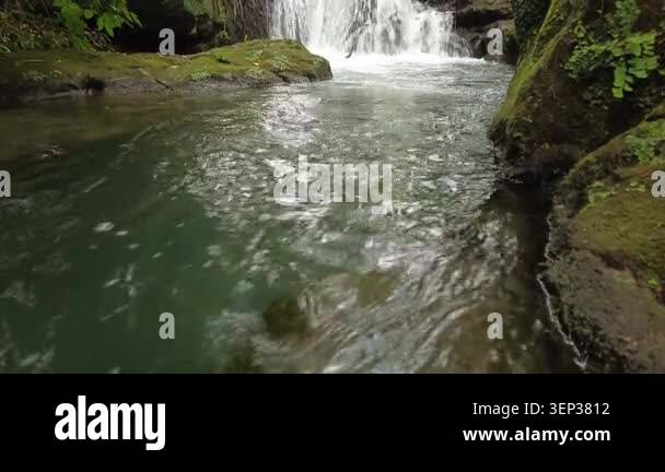 Wild nature waterfall and flowing river stream, slow motion video ...