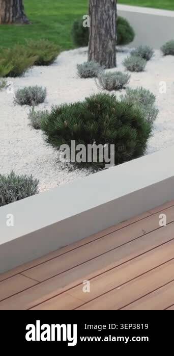 Vertical video. Modern architecture outdoor terrace with wooden decking ...
