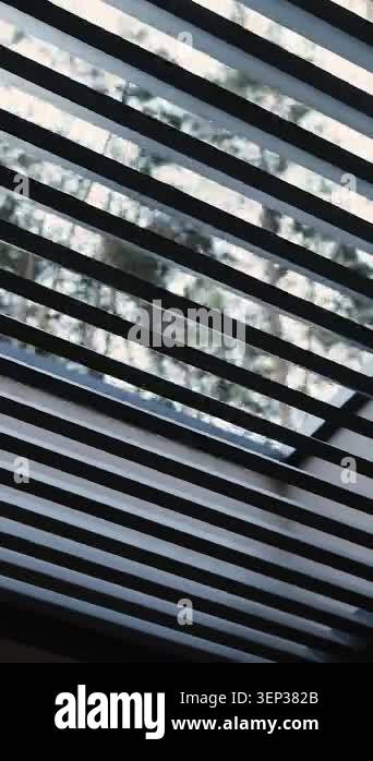 Vertical video. Modern architecture slatted roof design with natural ...