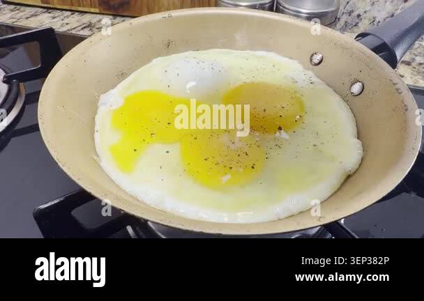 Cooking eggs in the pan, Home made cooking Stock Video Footage - Alamy