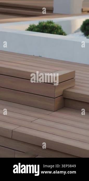 Vertical video. Wooden terrace beside modern house with large windows ...