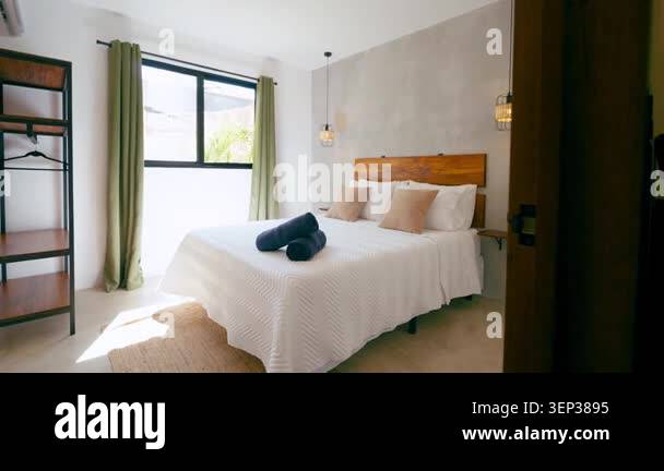 Bright and modern hotel bedroom with minimalist interior design ...