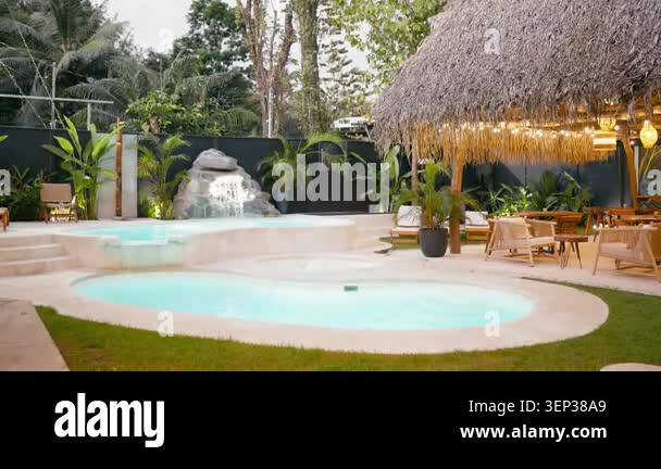 Beautiful view of a luxury hotel swimming pool area with a small ...