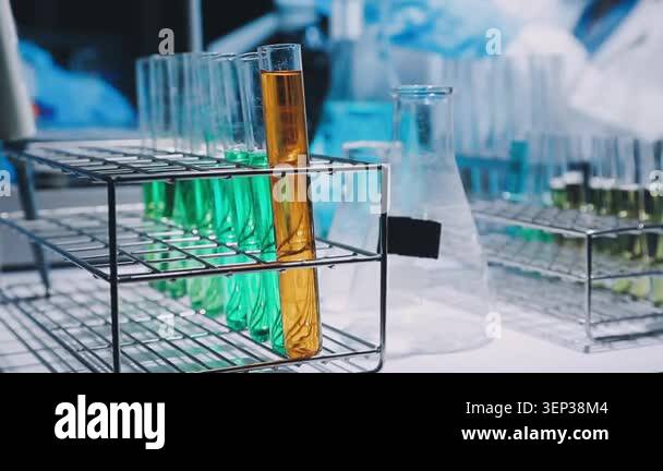laboratory test tubes with blue liquid Stock Video Footage - Alamy