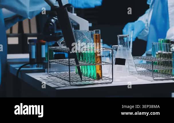 test tube with liquid on the table Stock Video Footage - Alamy