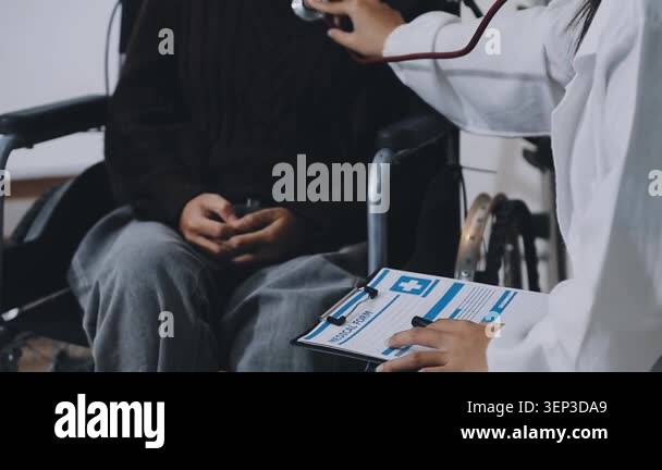 doctor in wheelchair with stethoscope Stock Video Footage - Alamy
