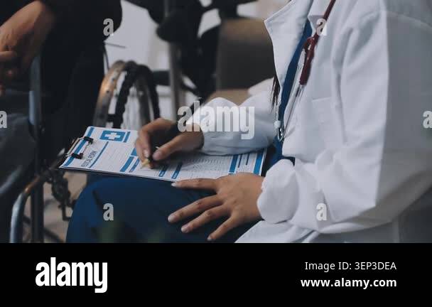 young asian doctor woman with patient sitting at hospital and talking ...
