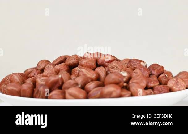Hazelnuts heap rotating. Organic snack. Pile of hazelnuts without shell ...