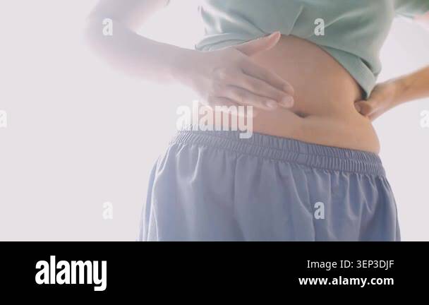 young woman suffering from stomach pain, closeup. medical concept Stock ...