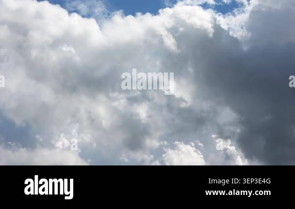 Time lapse Ominous grey and white storm clouds gathering and moving ...