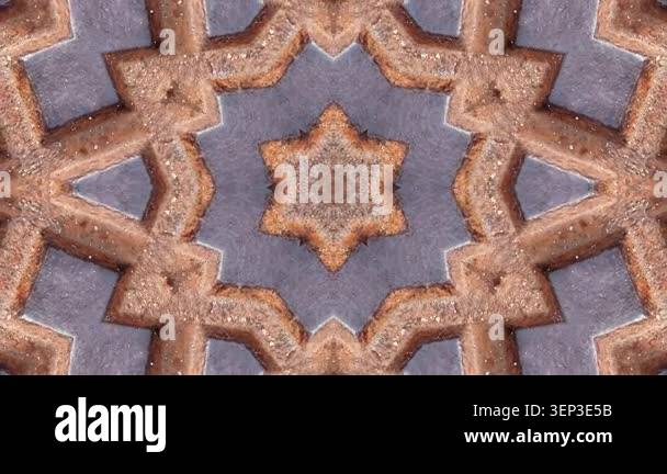 Intricate rusty metal grid forming a complex, evolving kaleidoscopic ...