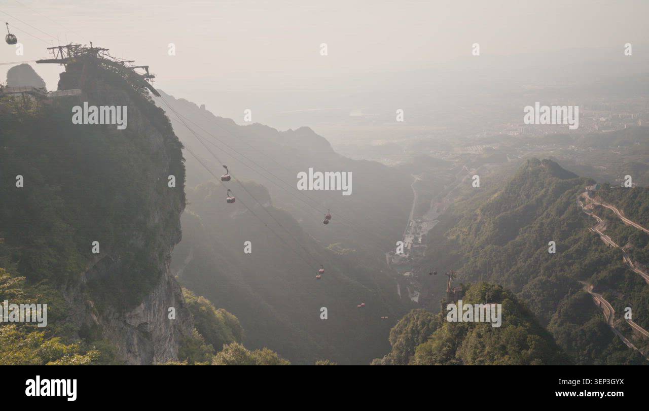 Cable cars drifting through golden haze Stock Video Footage - Alamy