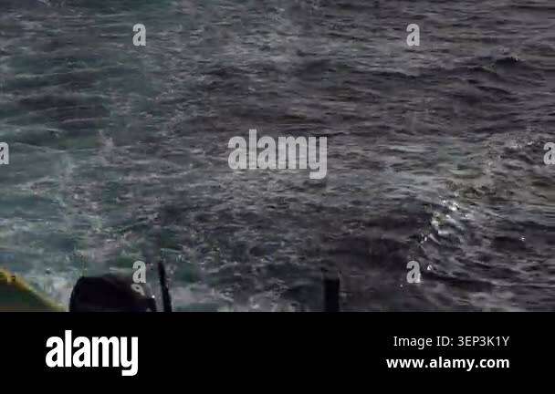 Antarctic expedition. waves rolling behind the boat as it moves through ...