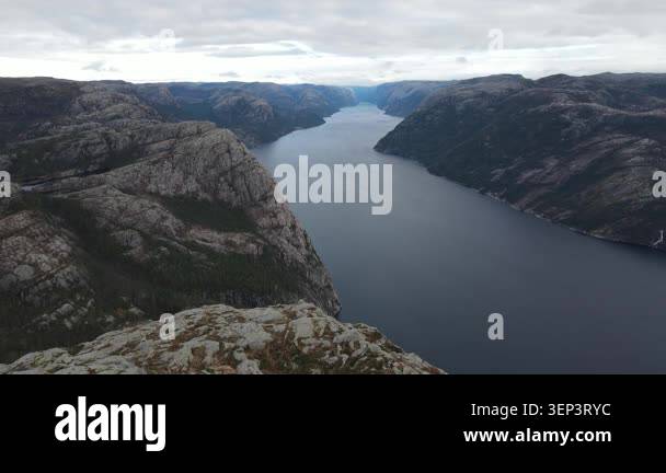 Breathtaking 4K drone shot from a rocky mountain summit overlooking the ...