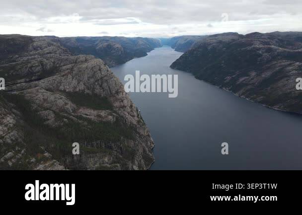 Grand 4K drone panoramic view flying over rugged mountain peaks along ...