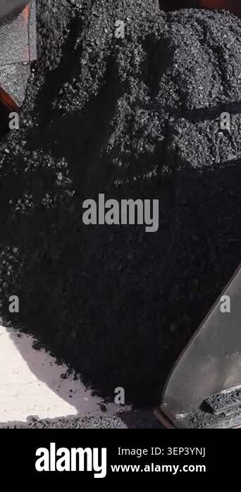 Workers prepare surface while machine lays fresh asphalt on road Stock ...