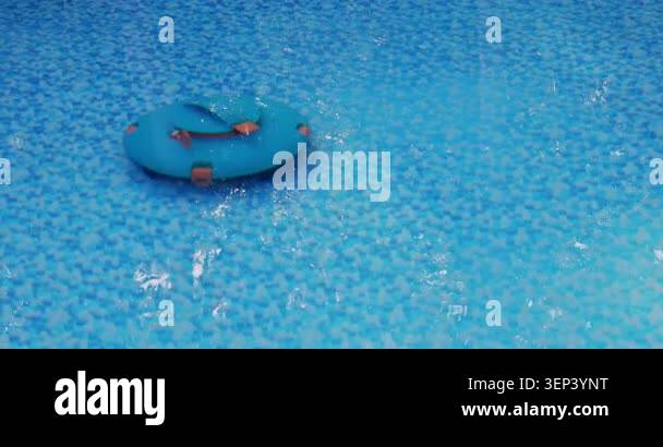 Floating robotic vacuum is works on blue surface in swimming pool ...