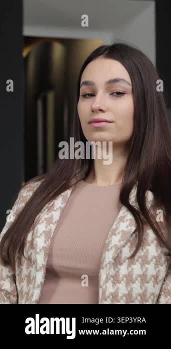 Beautiful young woman with dental braces smiling at the camera and ...