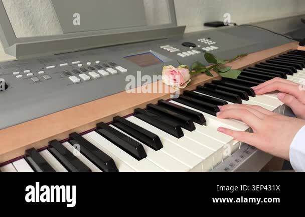 Female Hand Pressing Piano Key Repeatedly Creating Single Note Sound on ...