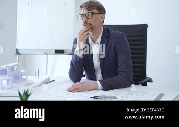 Experienced architect deeply contemplating design concepts, reviewing ...